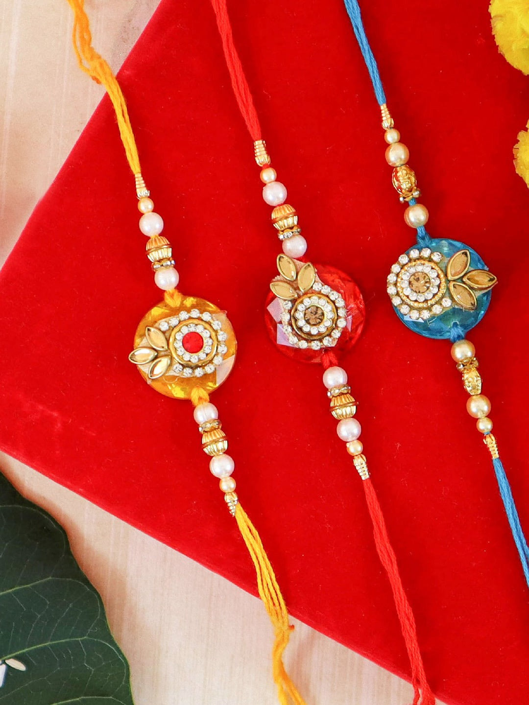 Buy | Set of 3 Premium Pearl Rakhi with Card & Roli Chawal | Tied Ribbons